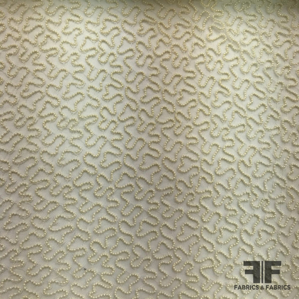 Couture Swivel Beaded Netting - Ivory – Fabrics & Fabrics