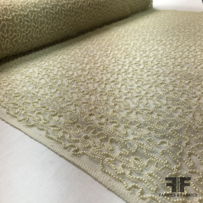 Couture Swivel Beaded Netting - Ivory – Fabrics & Fabrics